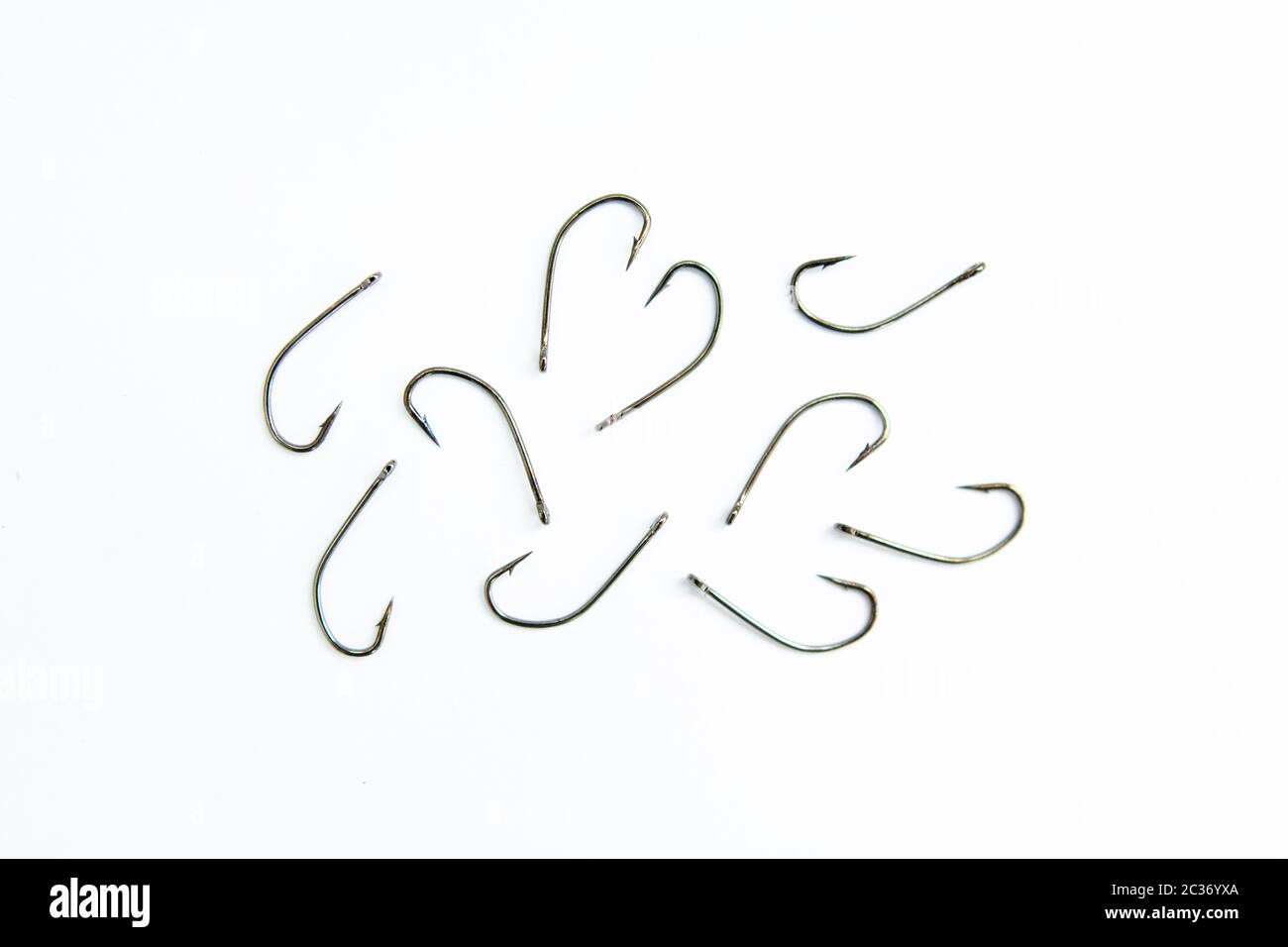 fishing hooks on white background Stock Photo - Alamy