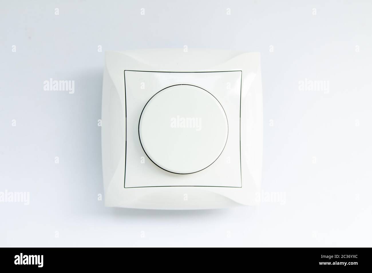 round light switch on white background Stock Photo - Alamy