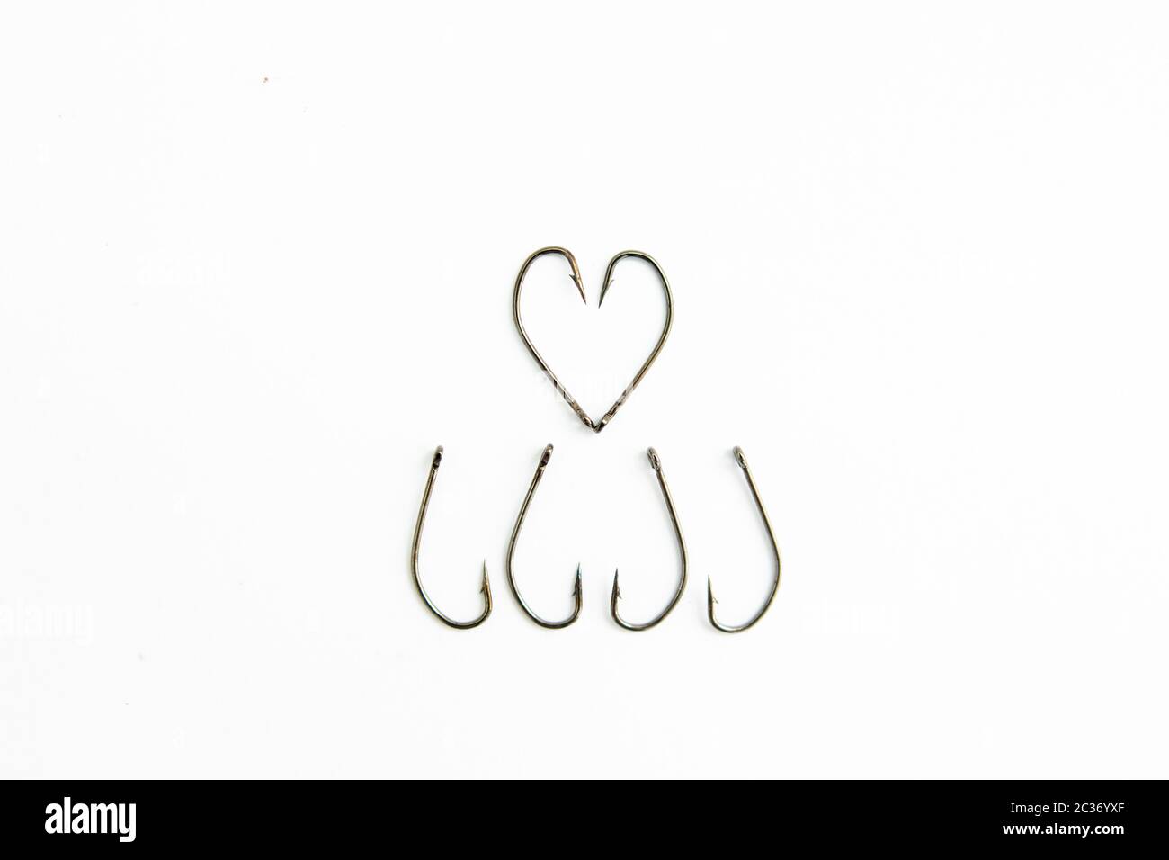 fishing hooks on white background Stock Photo - Alamy