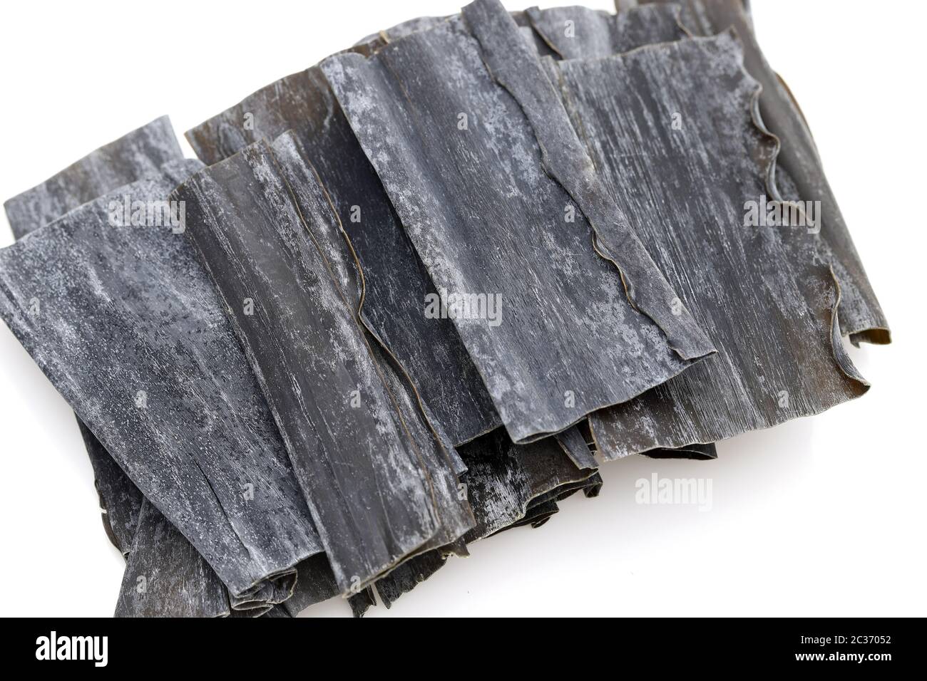 Japanese food konbu kelp on white background Stock Photo - Alamy