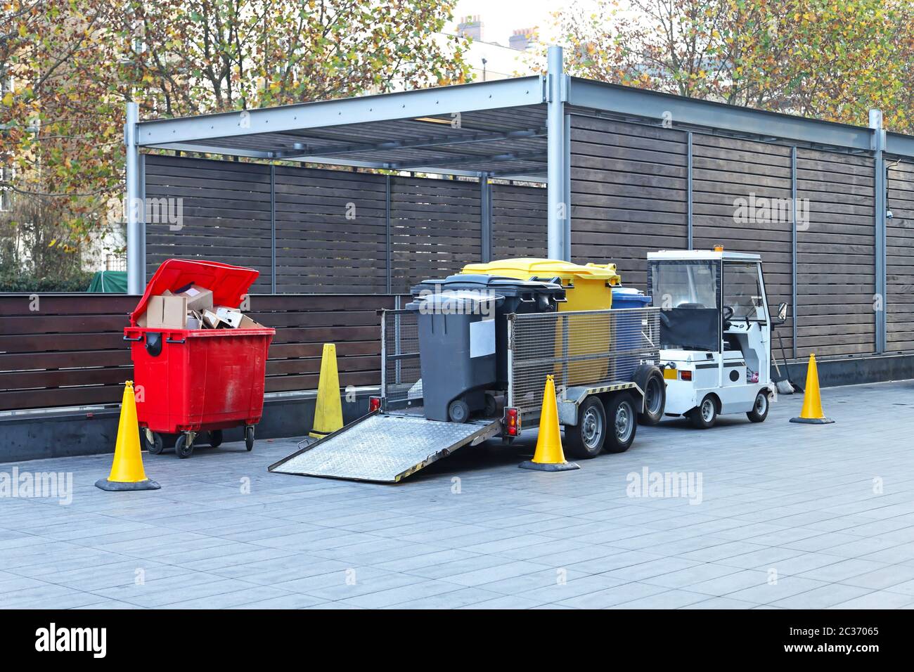 Electric vehicle with trailer for collecting garbage Stock Photo - Alamy