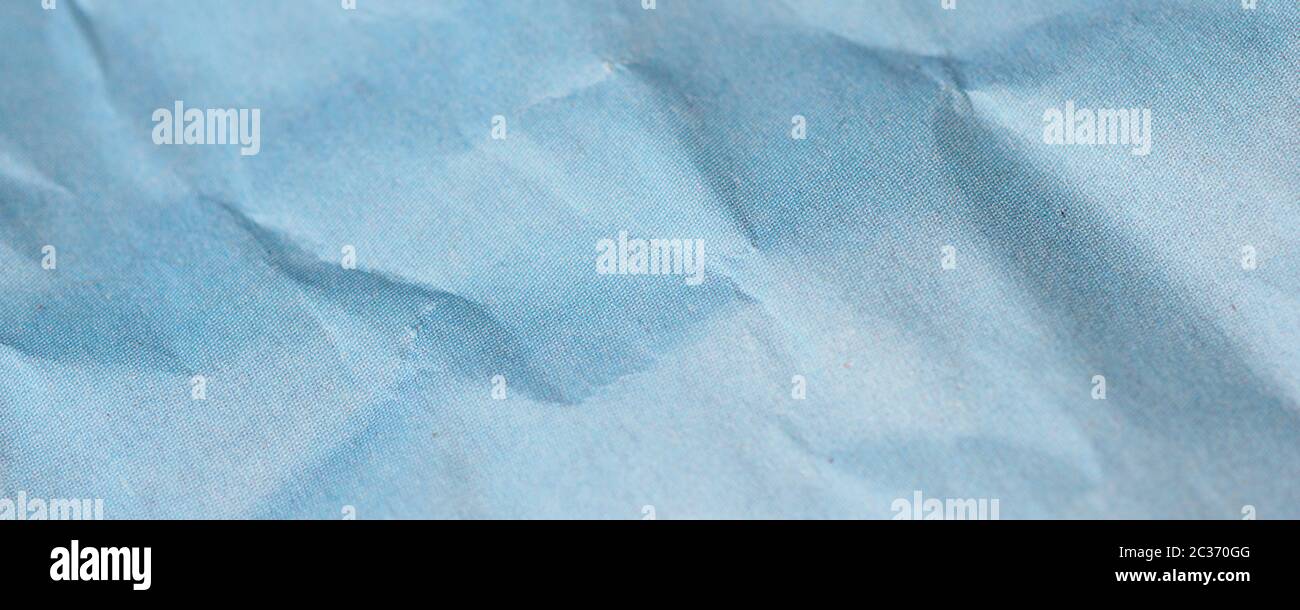 wide blue crinkled paper texture useful as a background Stock Photo - Alamy