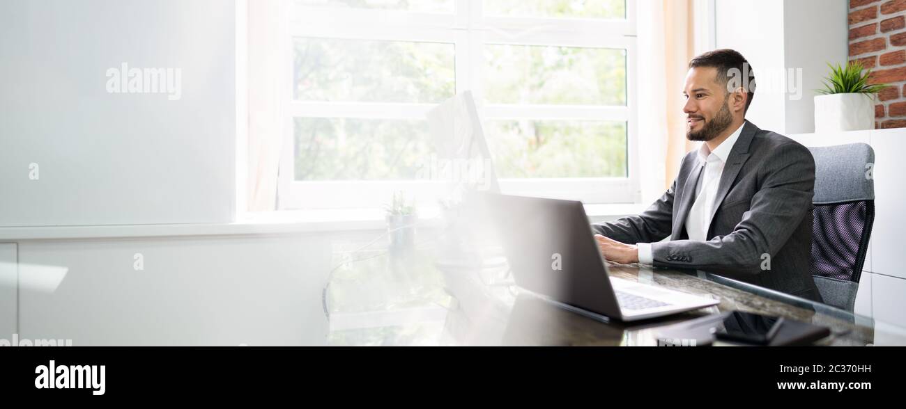 Employee Looking At Computer Screen At Office Stock Photo - Alamy