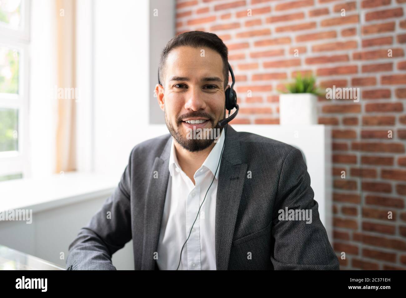Customer Service Agent Man In Call Center Stock Photo - Alamy
