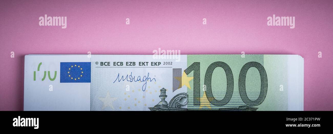 Euro cash on a lilac, purple and pink background. Euro Money Banknotes ...