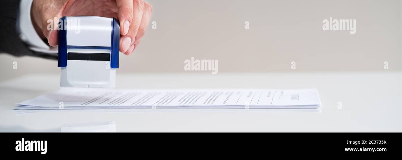 Work Permit And Document Record Approved Stamper Stock Photo - Alamy