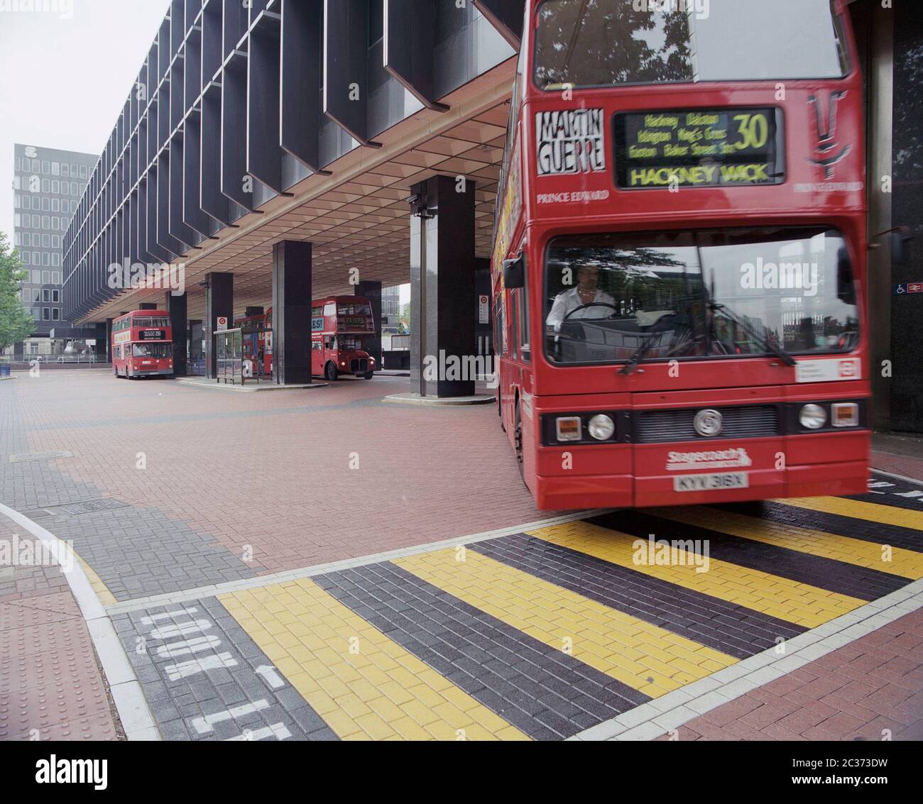 Buses and people travelling at Euston Bus Station, London, UK in 1996 ...