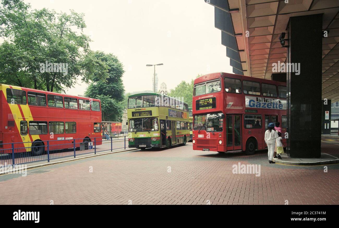 Buses and people travelling at Euston Bus Station, London, UK in 1996 ...