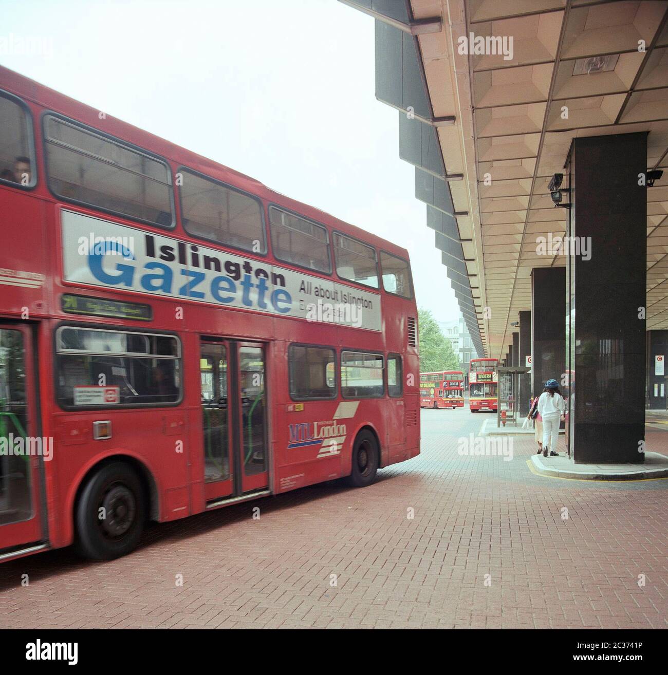Buses and people travelling at Euston Bus Station, London, UK in 1996 ...
