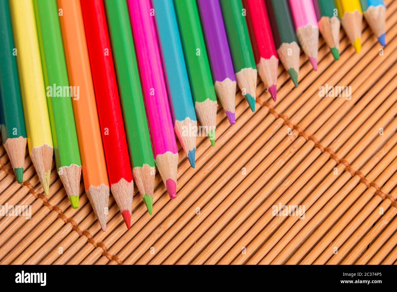 Wooden colorful pencils, on wooden table Stock Photo - Alamy