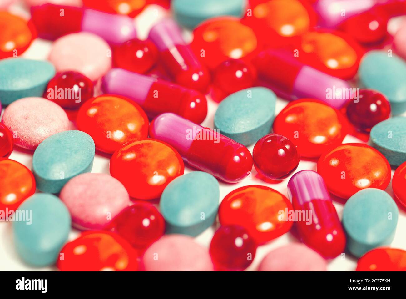Different colorful pills background Stock Photo - Alamy