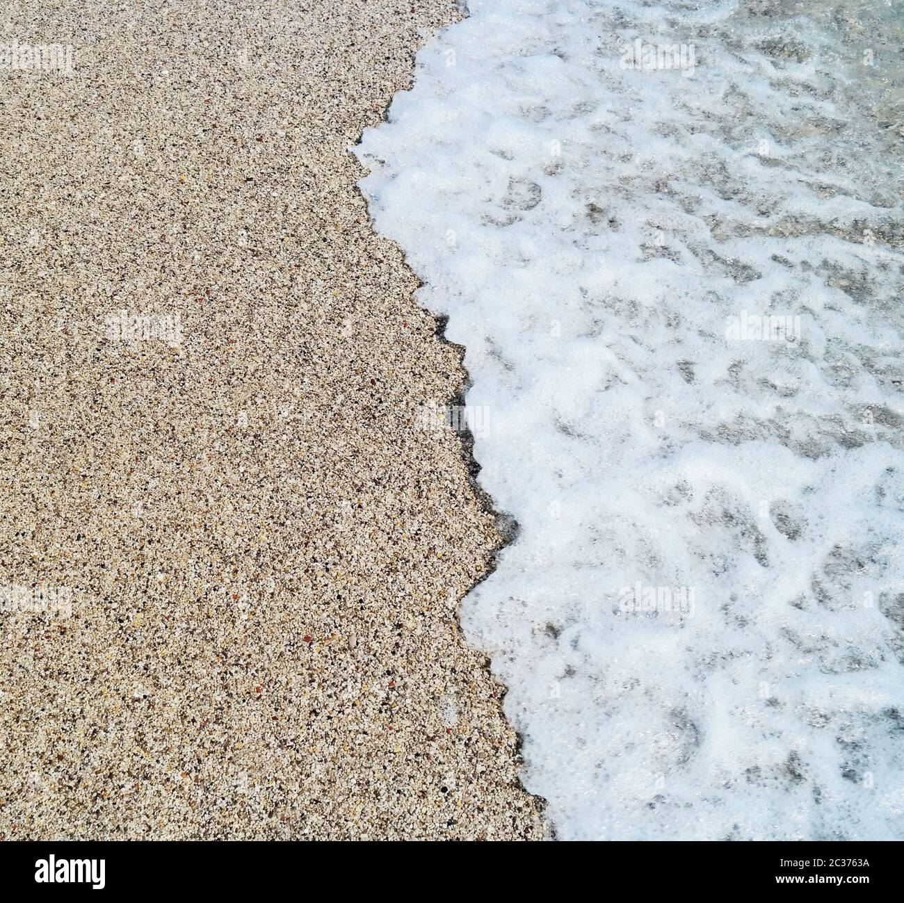 sea wave and yellow sandy beach background Stock Photo - Alamy