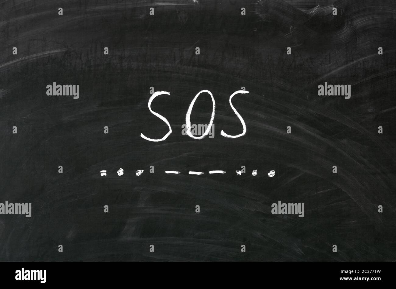 SOS word handwritten with white chalk on a blackboard Stock Photo - Alamy