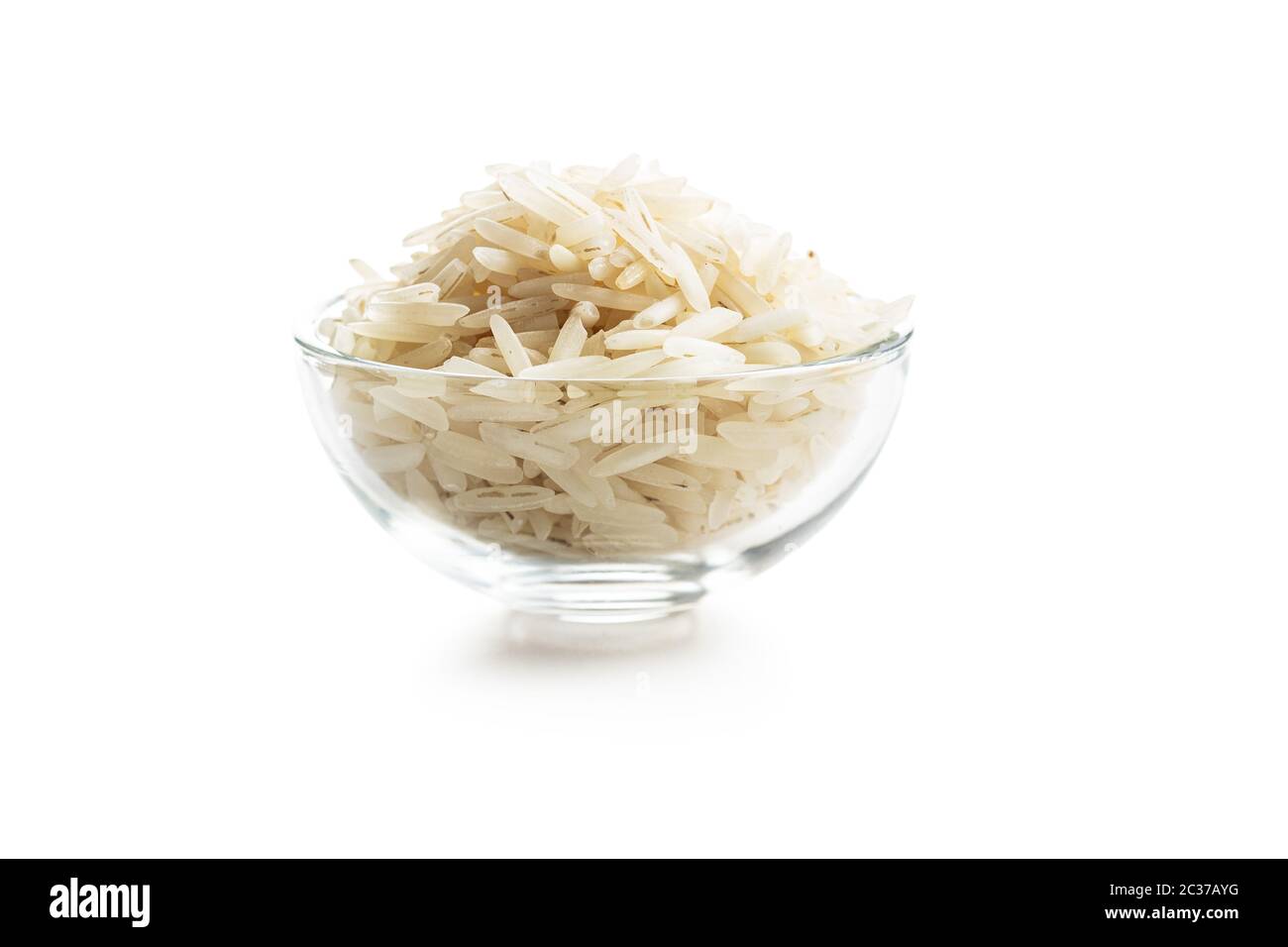 Uncooked indian long rice in bowl isolated on white background Stock ...