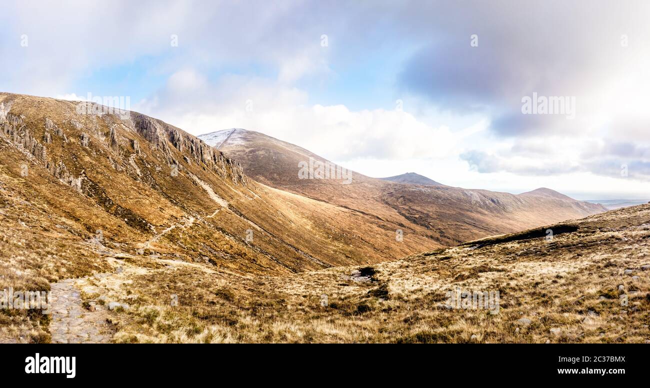 Footpath leading to snow capped peak of Slieve Donard mountain Stock ...