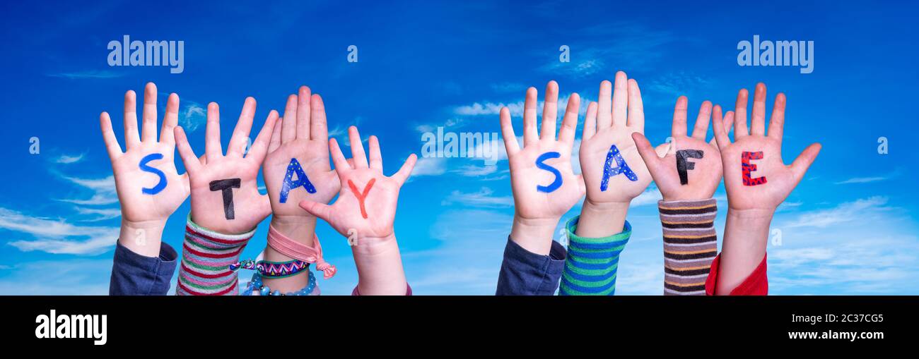 Kids Hands Holding Colorful English Word Stay Safe. Blue Sky As ...