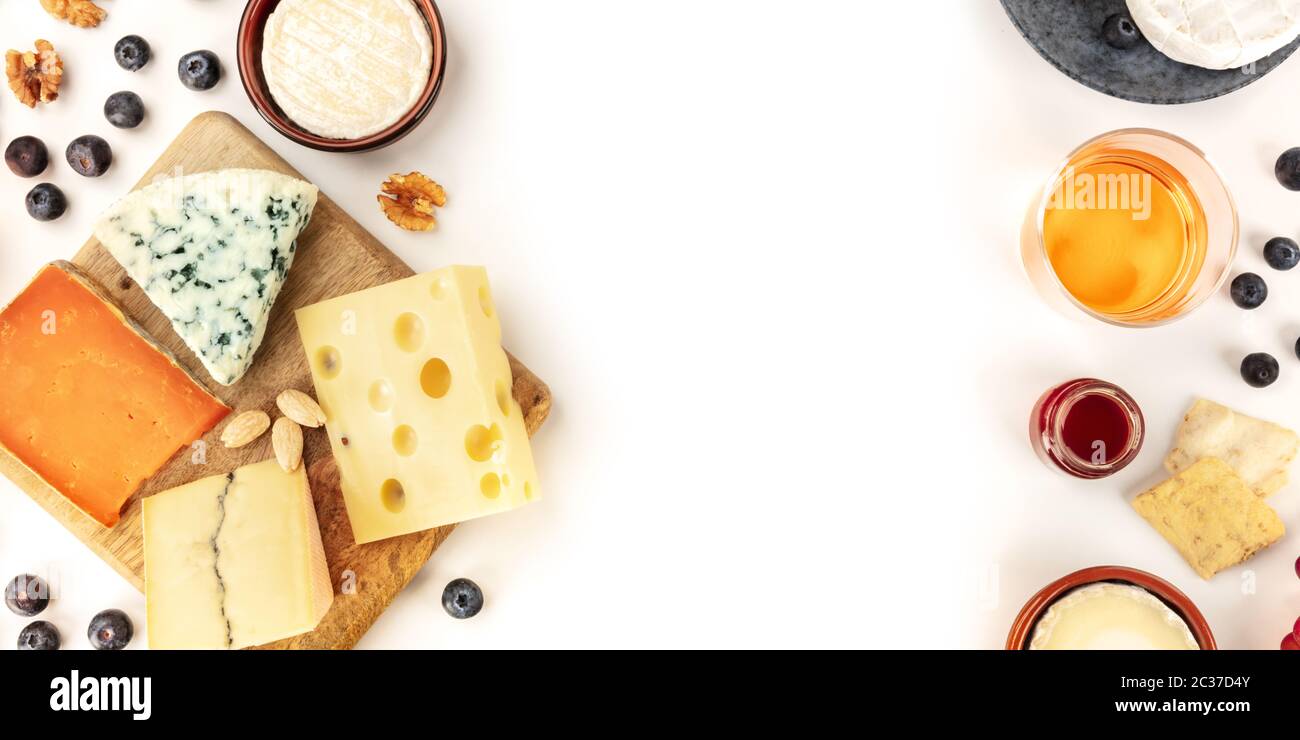 Cheese panoramic background, a top shot on white with copy space. An ...