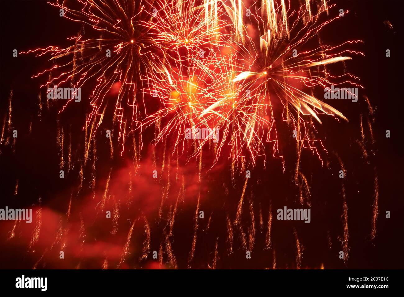 Red colorful fireworks on the black sky background Stock Photo - Alamy