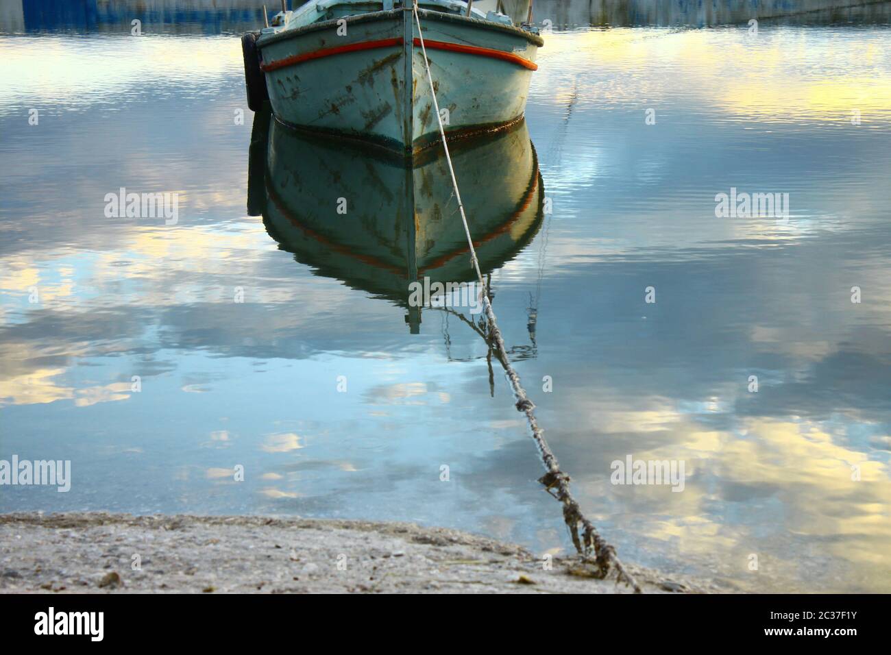 Reflection of boats in a small harbour Stock Photo - Alamy