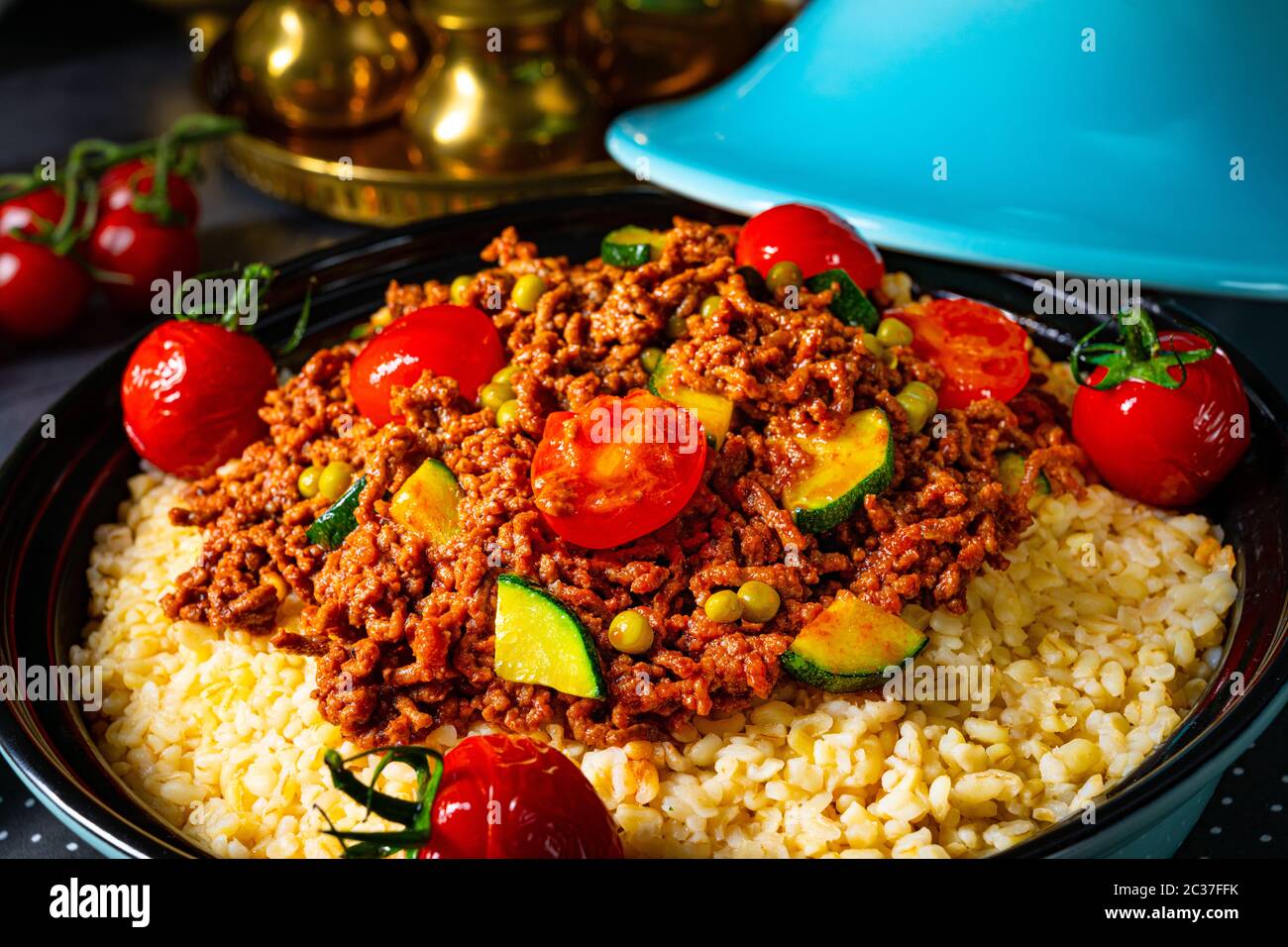 Tomato bulgur with vegetables and minced meat Stock Photo - Alamy