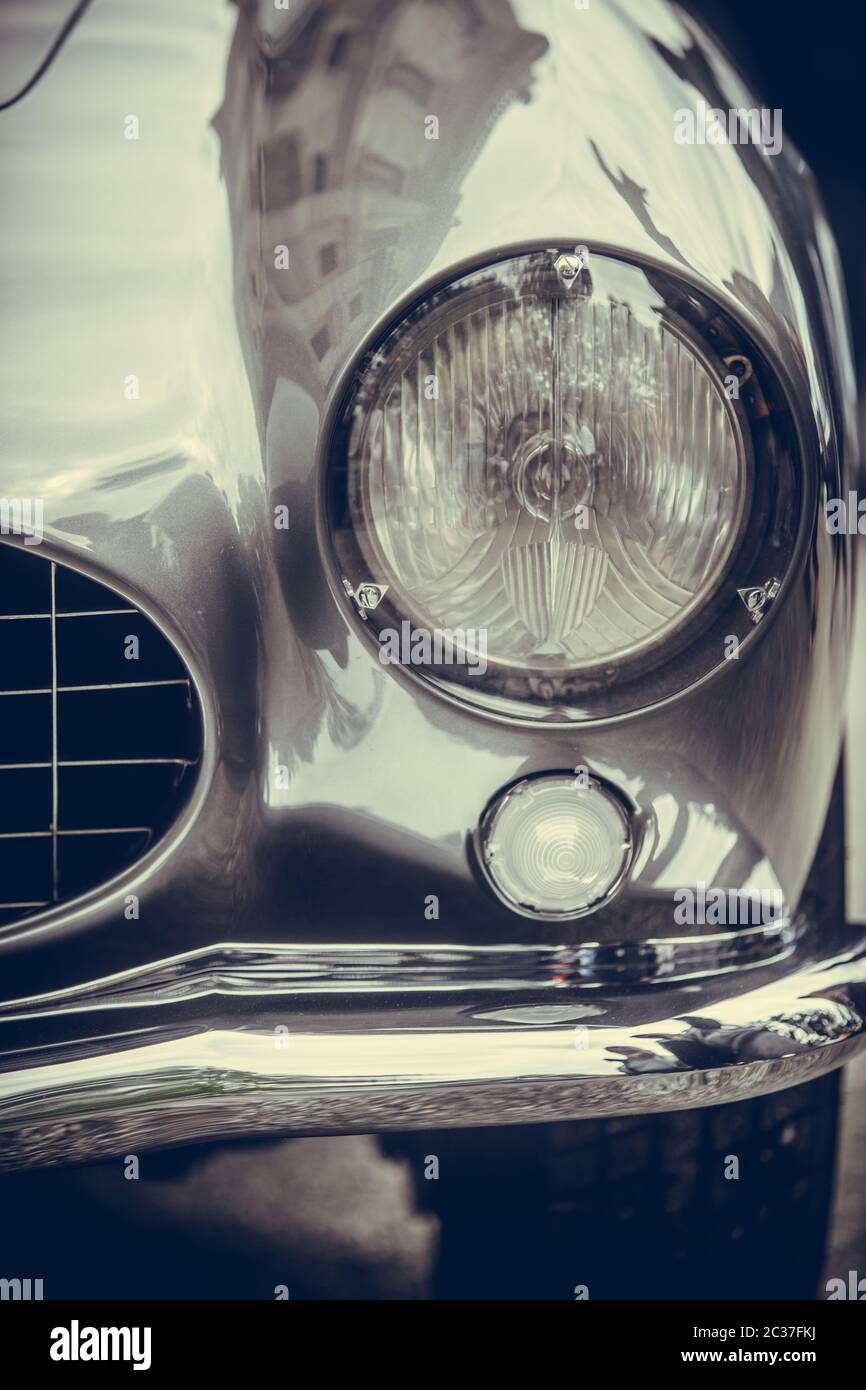 Close up vertical image of the headlight of a vintage classic car Stock ...