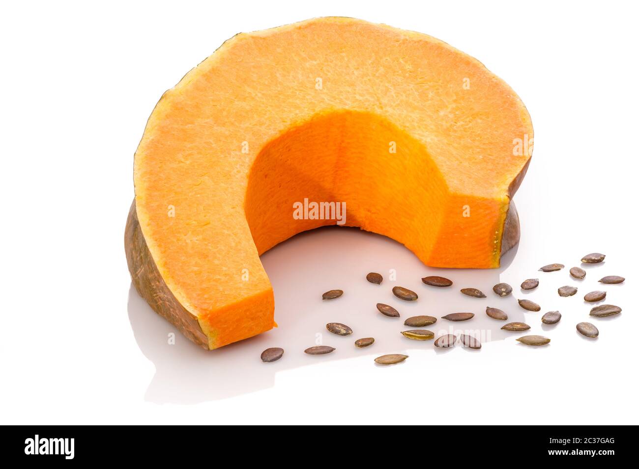 Orange pumpkin slice with seeds white isolated Stock Photo - Alamy