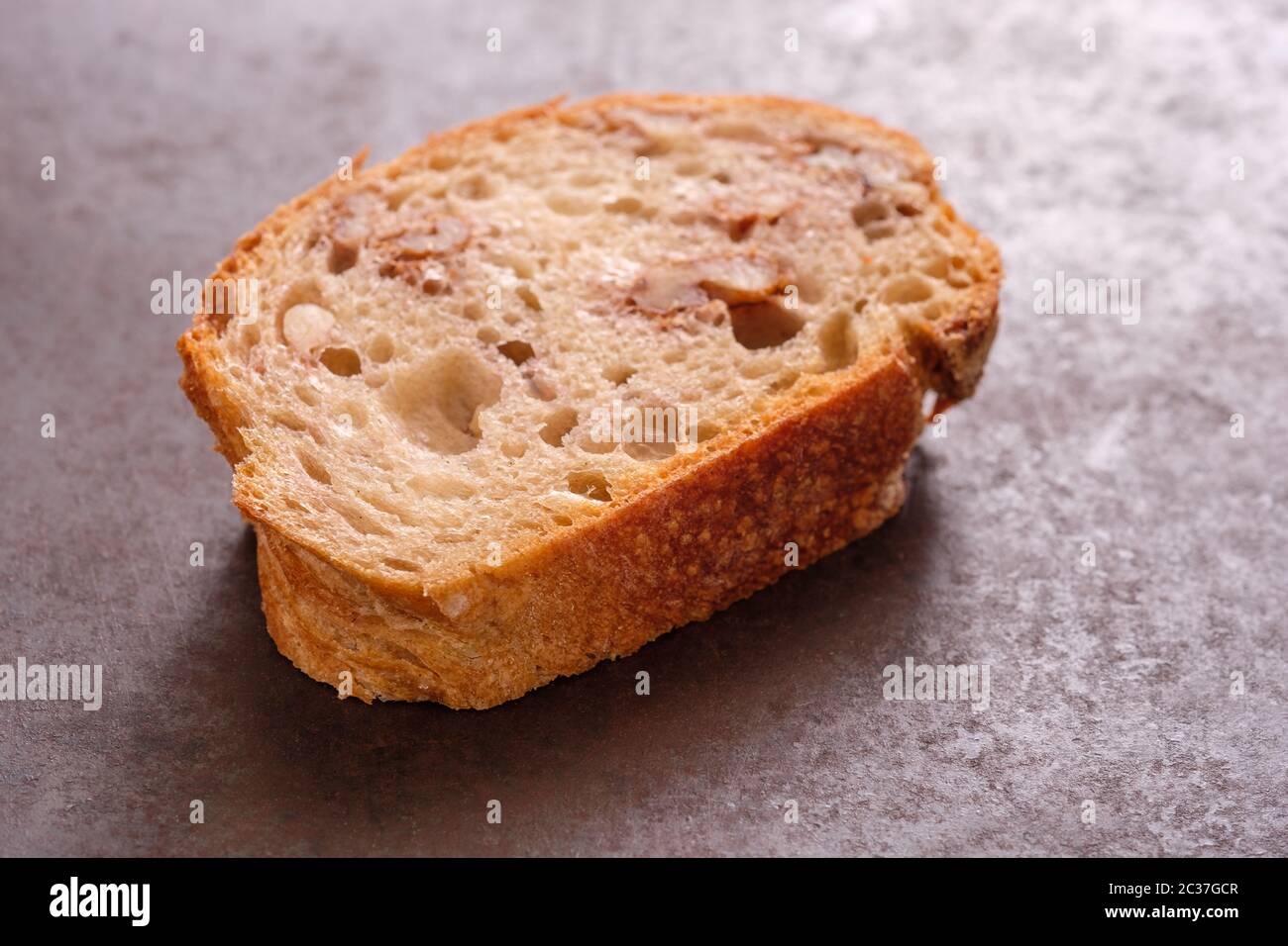 Slice bread with walnut on baking tray in back lit Stock Photo - Alamy