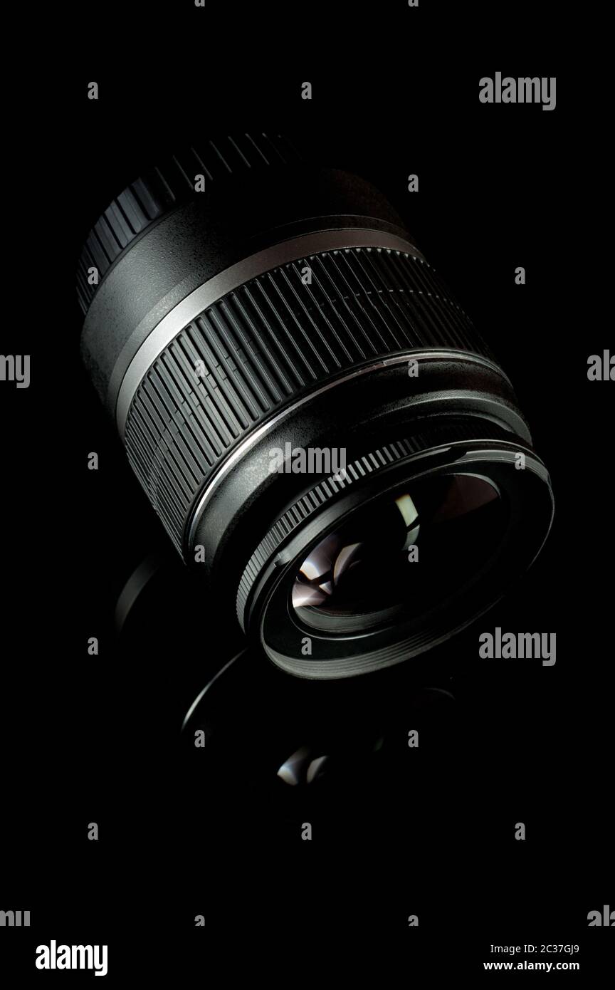 Black camera lens isolated on black background Stock Photo - Alamy