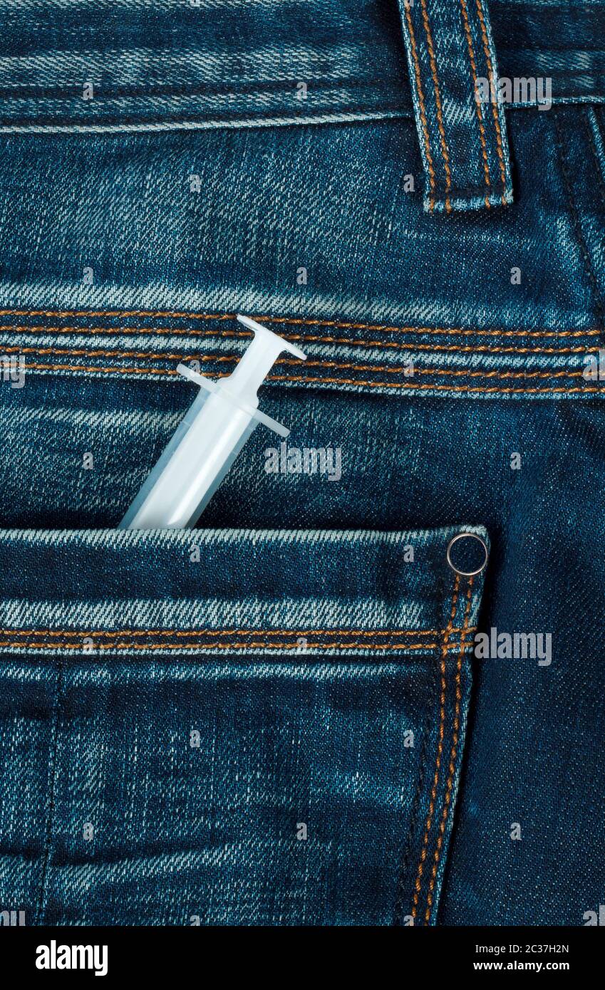 pocket jeans with a syringe sticking out Stock Photo - Alamy