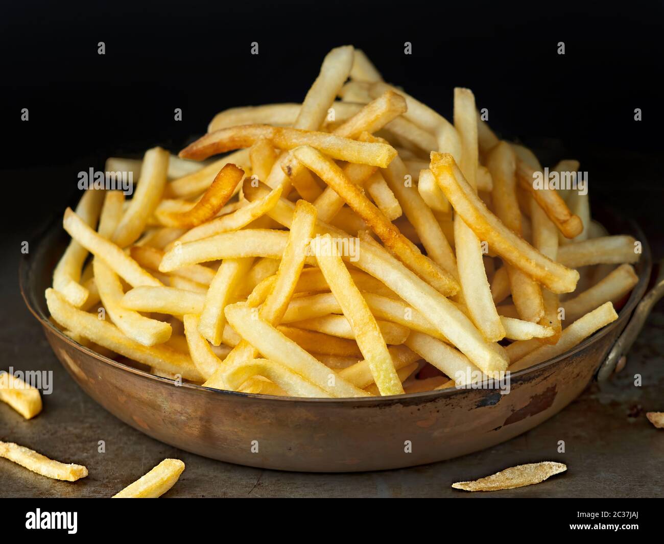 close up of pan of rustic golden french fries Stock Photo - Alamy