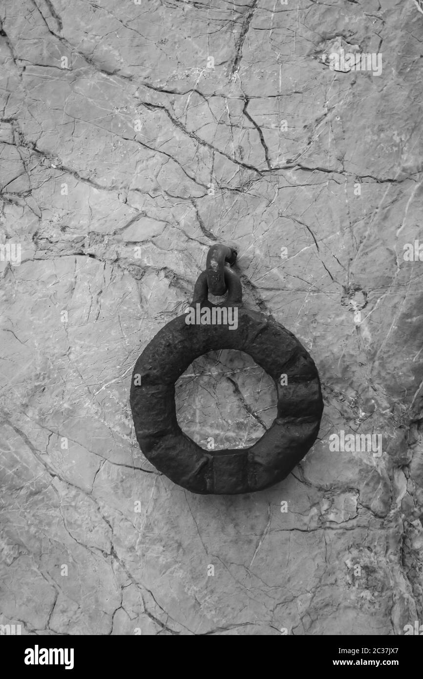 rusty iron rings for attaching things, objects Stock Photo - Alamy