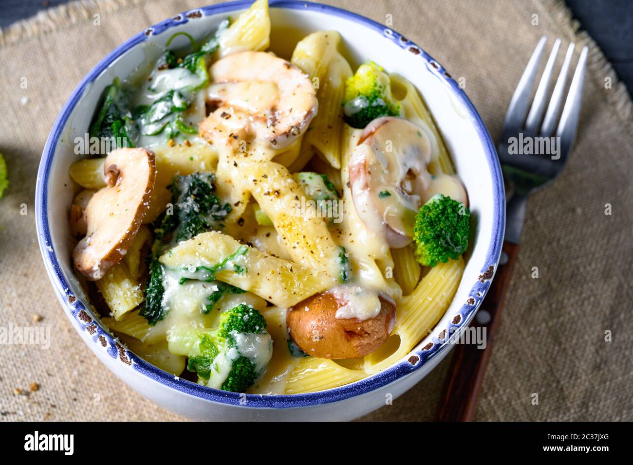 Real pasta with mushrooms, spinach and broccoli Stock Photo - Alamy