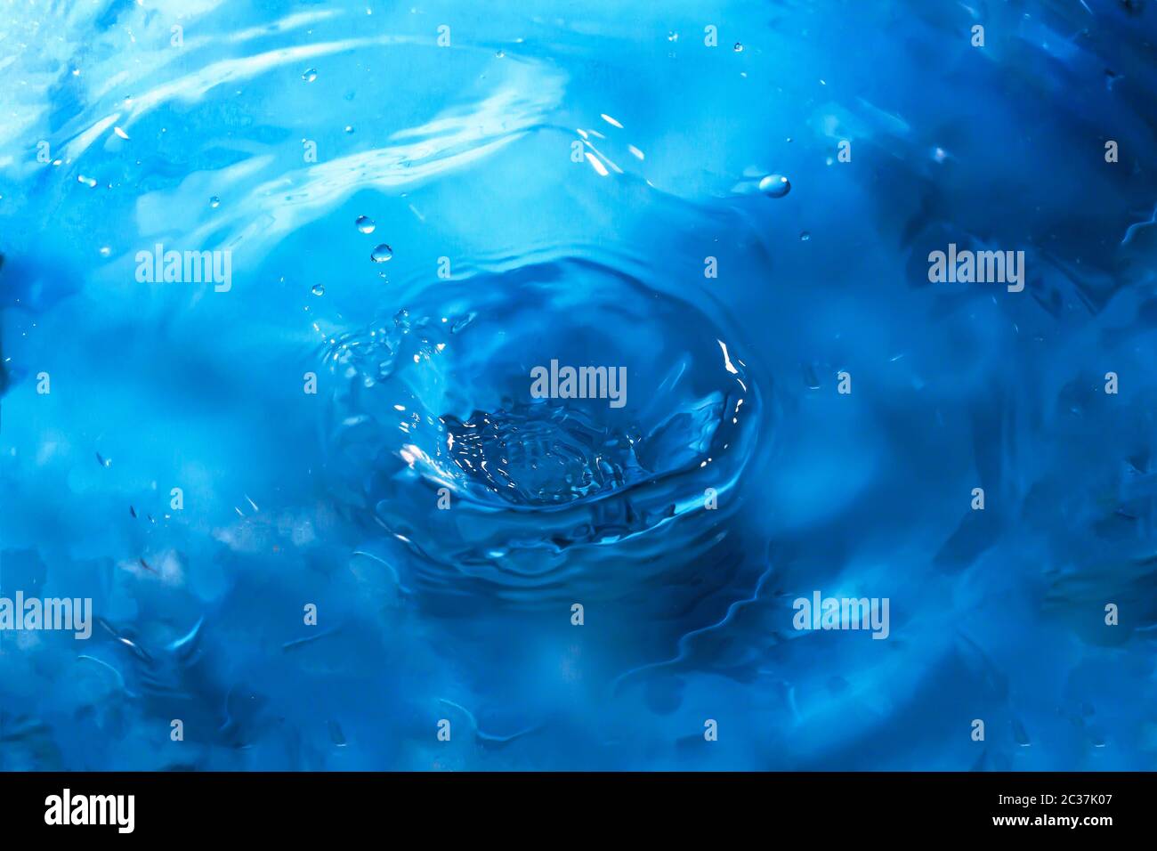 Drop of water. Blue water drop. Falling water. Water splash close-up ...