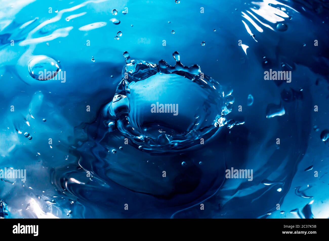 Drop of water. Blue water drop. Falling water. Water splash close-up ...
