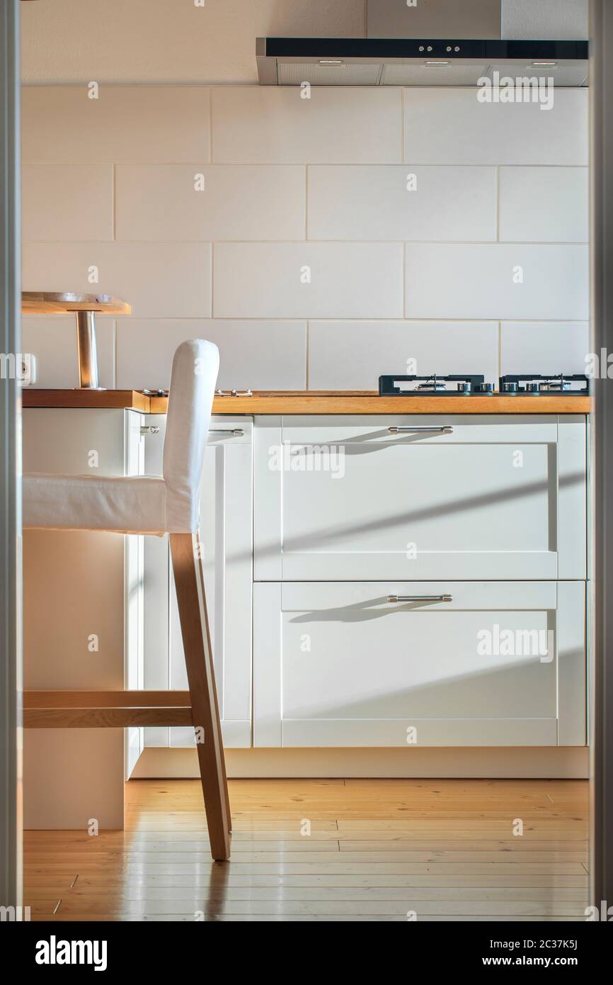 Modern kitchen in white with cooking hob Stock Photo - Alamy