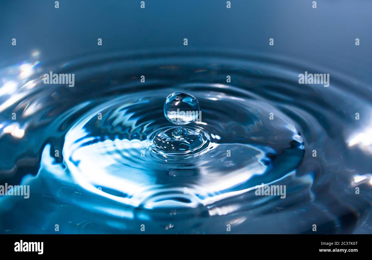 Water splash or drop. Water splash close-up. Blue water drop. Falling ...