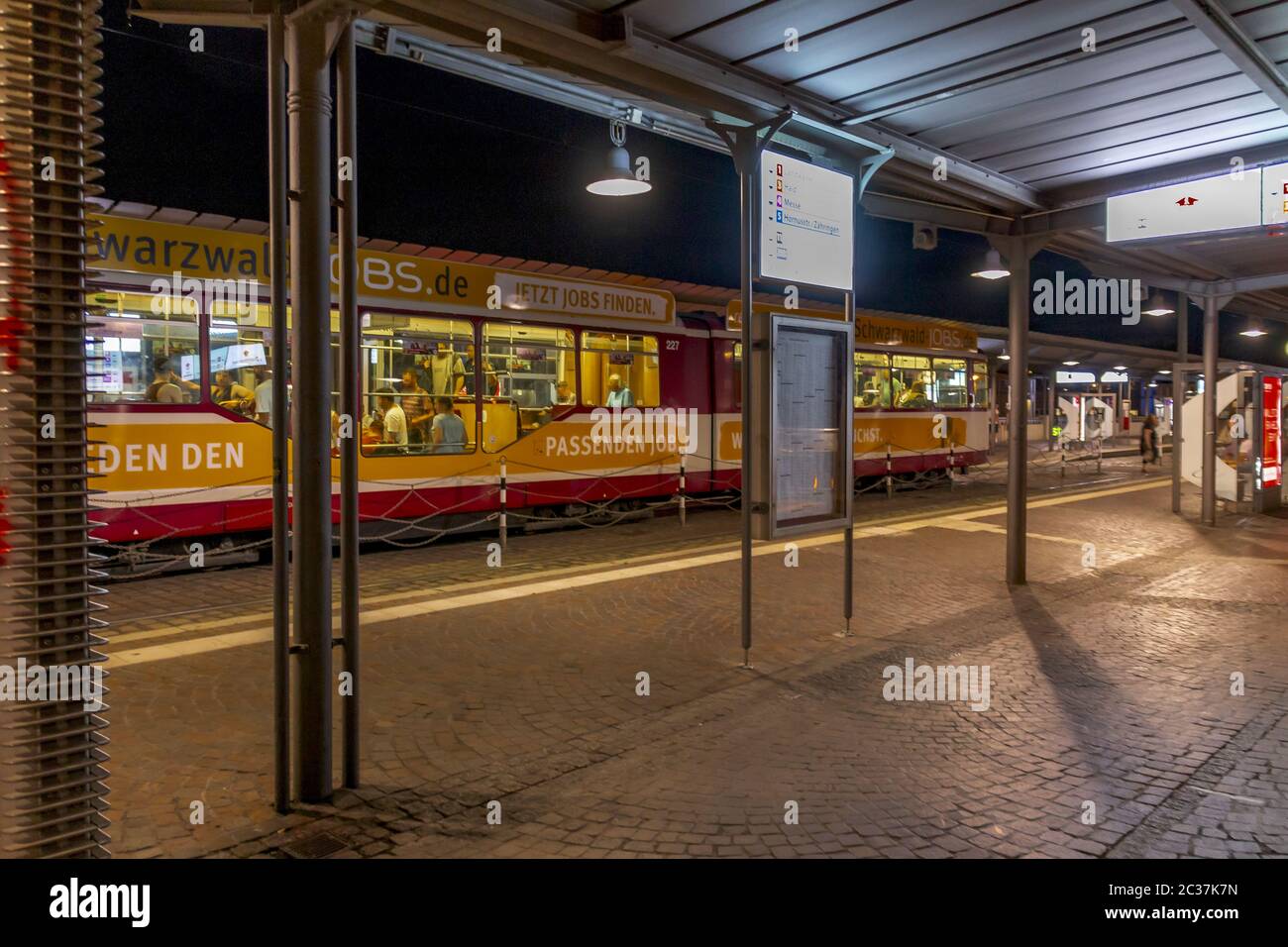 Light rail stop - at night Stock Photo - Alamy