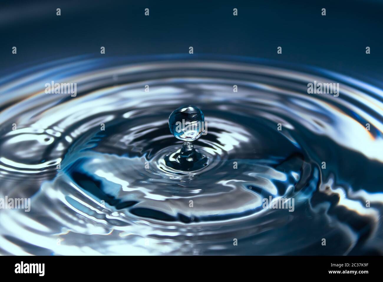 Water splash or drop. Water splash close-up. Blue water drop. Falling ...
