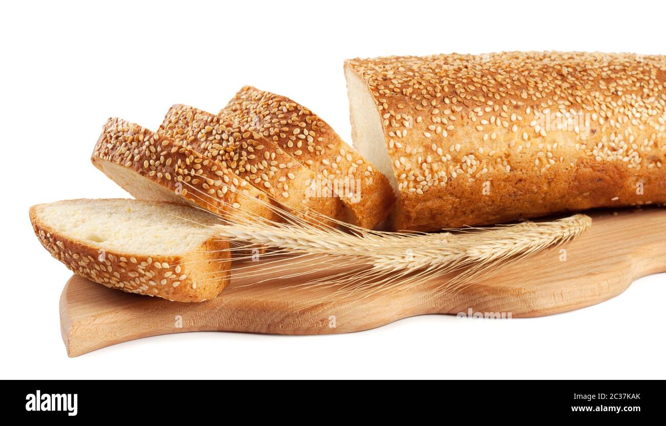 A loaf of white bread with sesame seeds isolated on white background ...