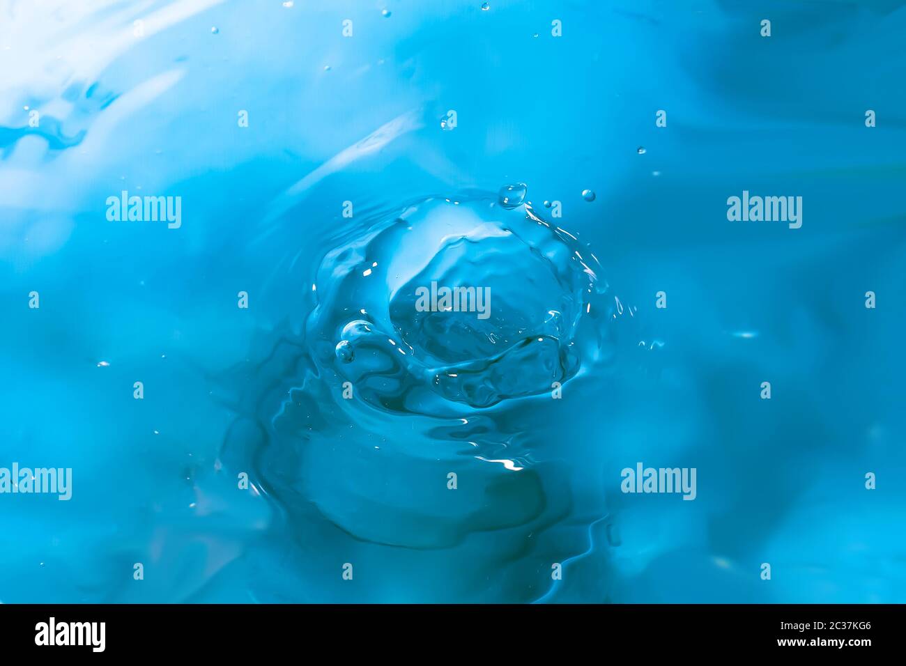 Water splash close-up. Drop of water. Blue water drop. Falling water ...