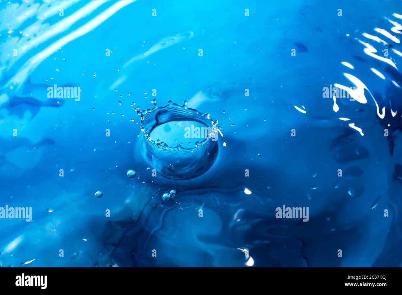 Drop of water. Blue water drop. Falling water. Water splash close-up ...