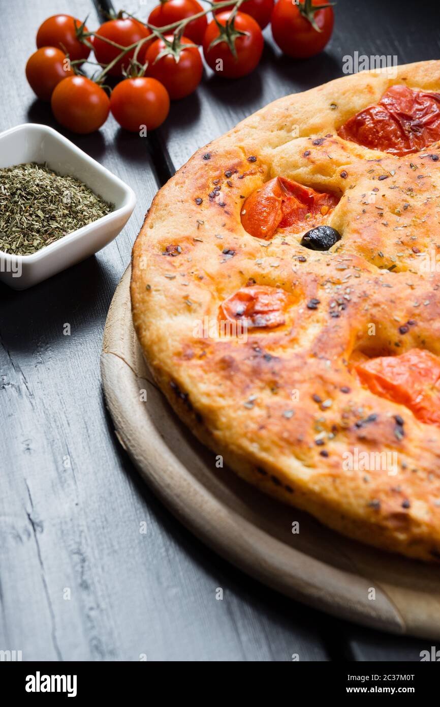 Homemade focaccia on rustic board Stock Photo - Alamy