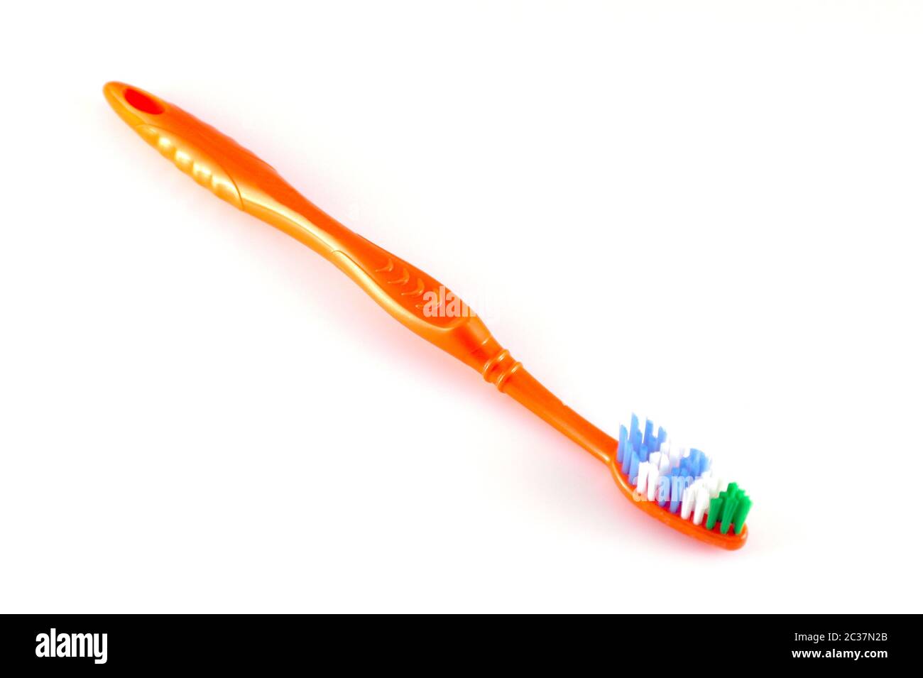 Orange toothbrush over white Stock Photo - Alamy