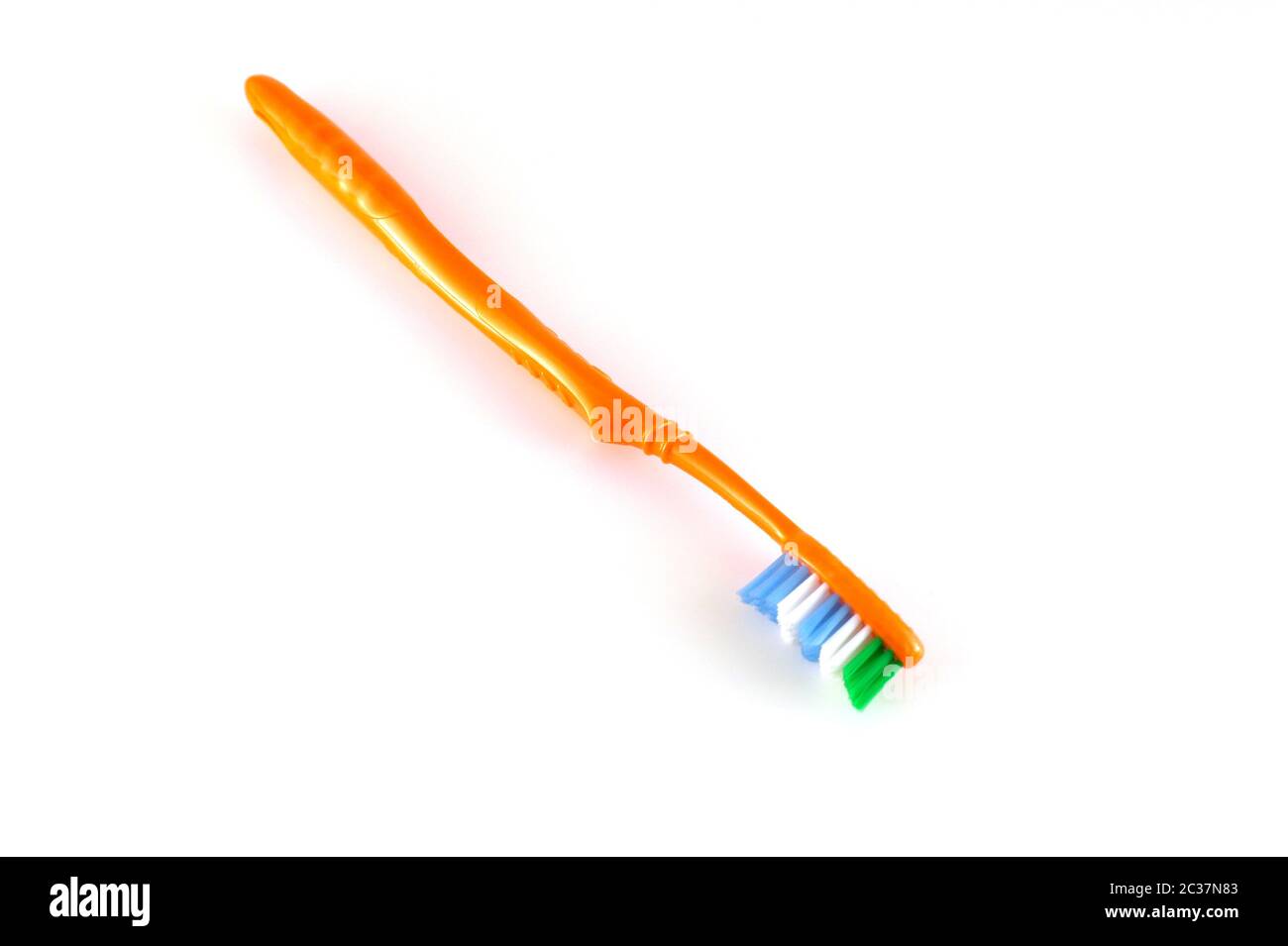 Orange toothbrush over white Stock Photo - Alamy