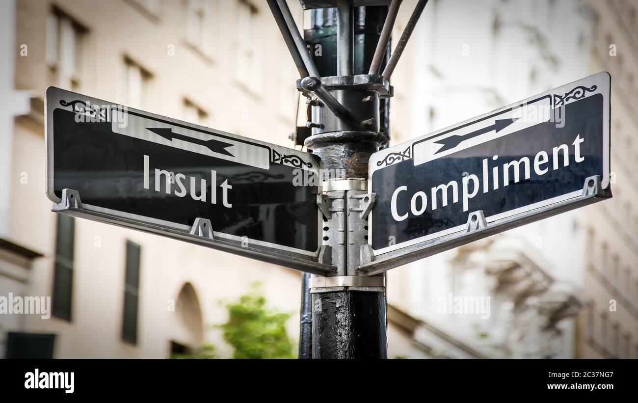 Street Sign Compliment versus Insult Stock Photo - Alamy