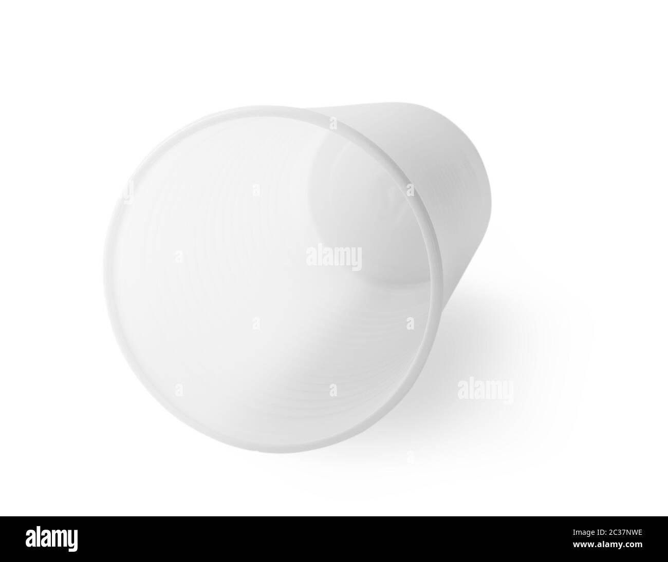 White plastic cup lying isolated on white background Stock Photo - Alamy