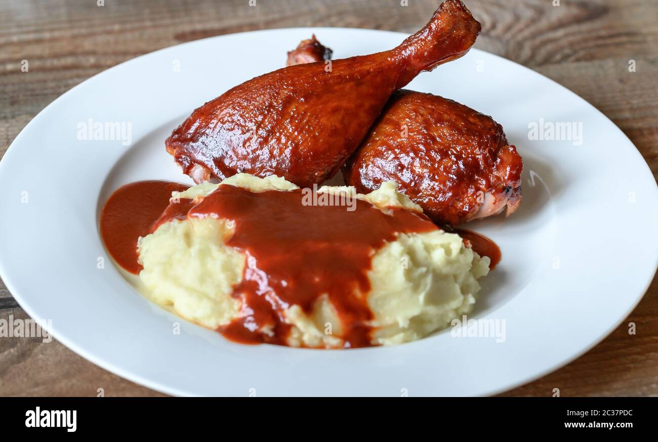 Barbecue duck legs with mashed potato close-up Stock Photo - Alamy