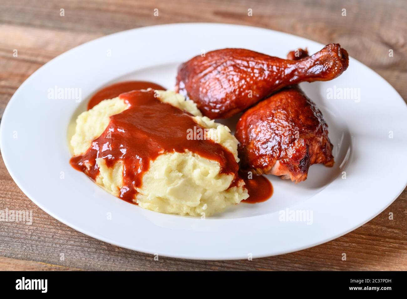 Barbecue duck legs with mashed potato close-up Stock Photo - Alamy