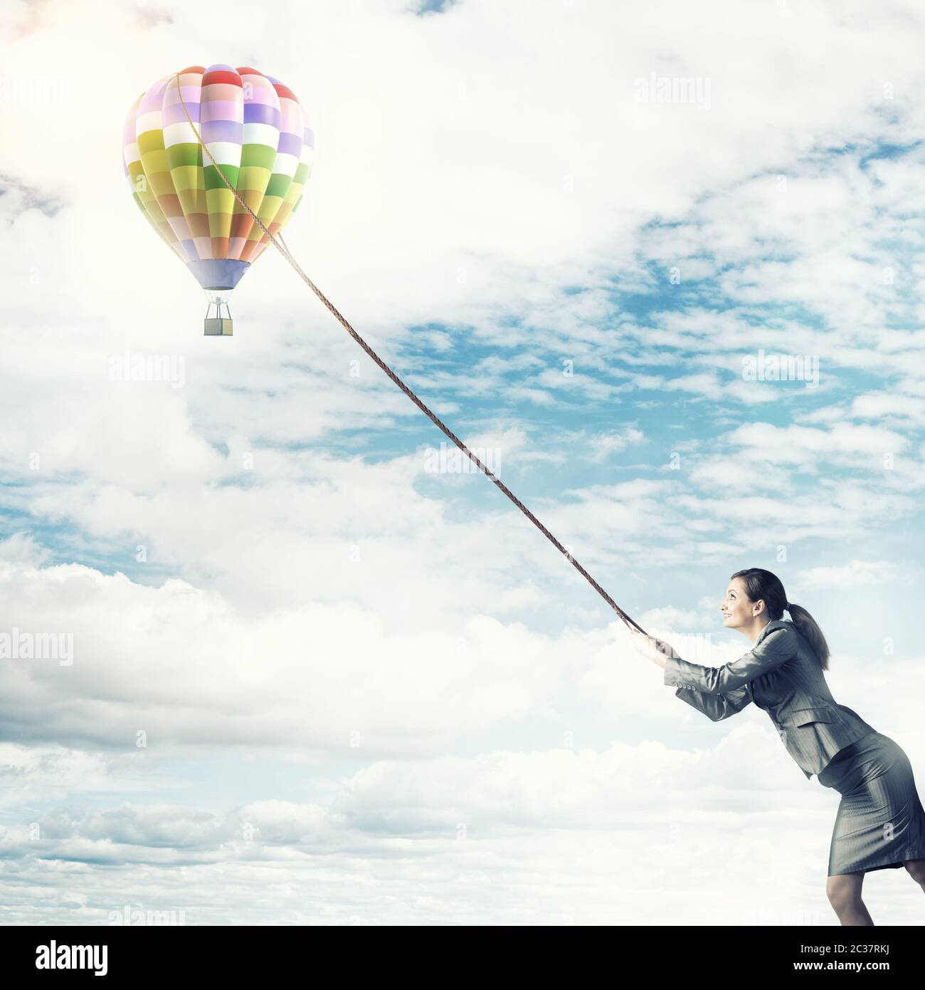 Woman catch balloon Stock Photo - Alamy
