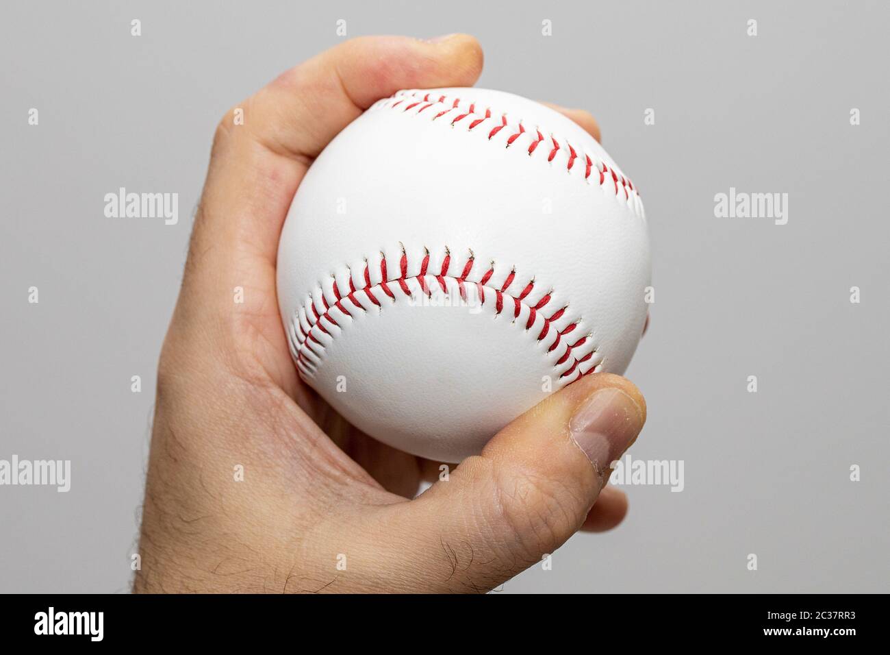 baseball ball white sport hand holding game Stock Photo - Alamy